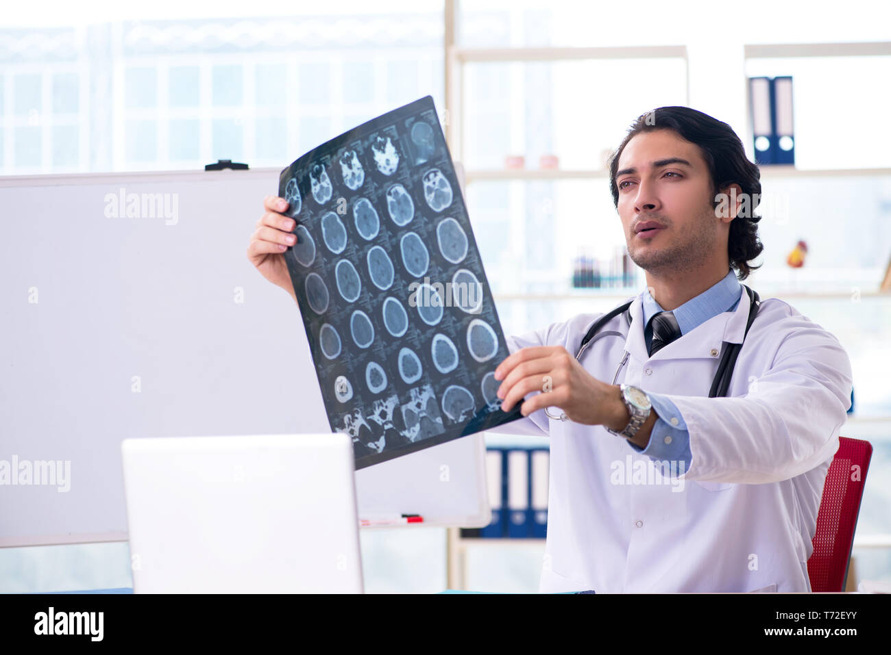 Young handsome male radiologist in front of whiteboard Stock Photo - Alamy