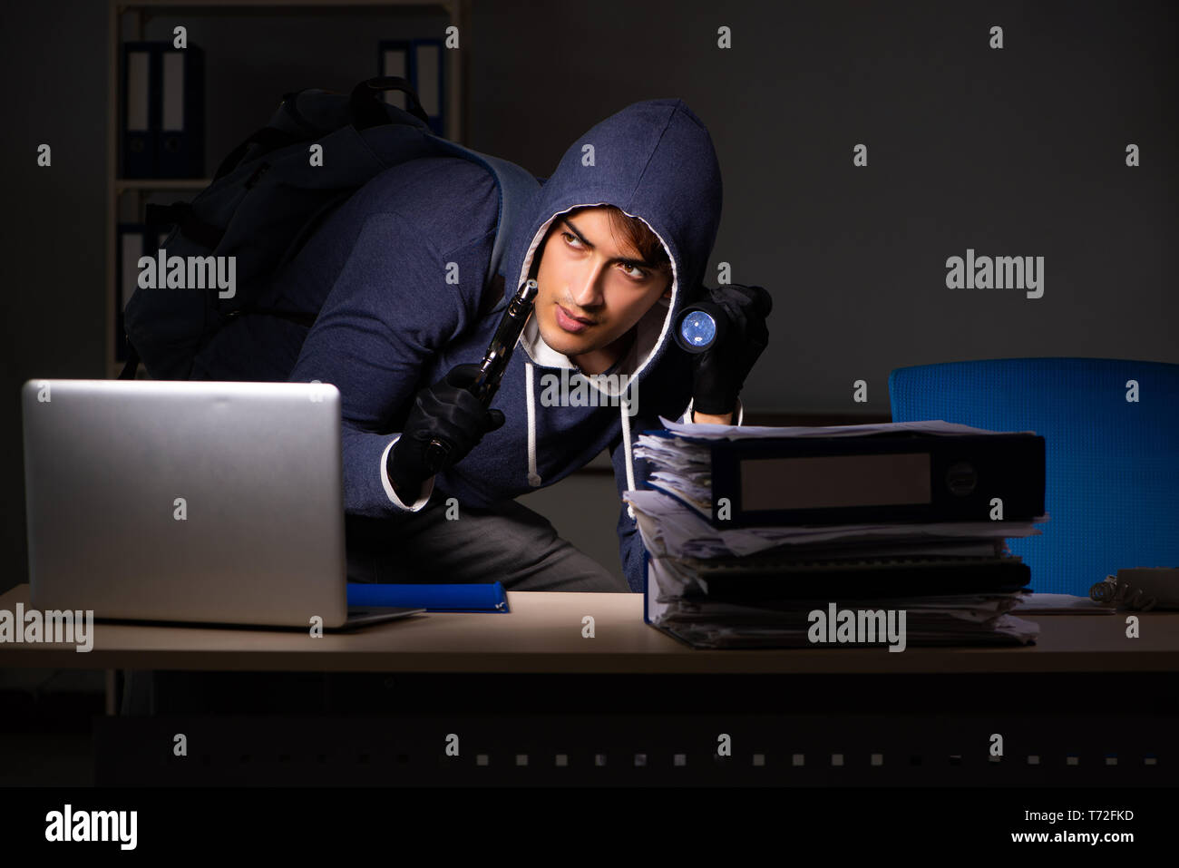 Thief trying to steal personal data in identity theft concept Stock ...