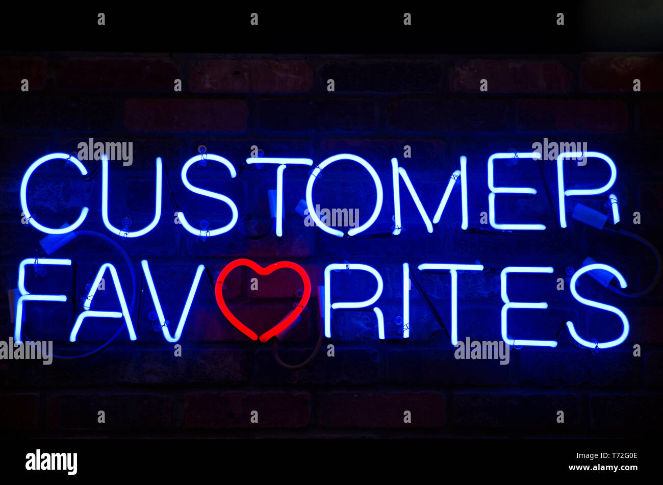 Neon sign-customer favorites Stock Photo - Alamy