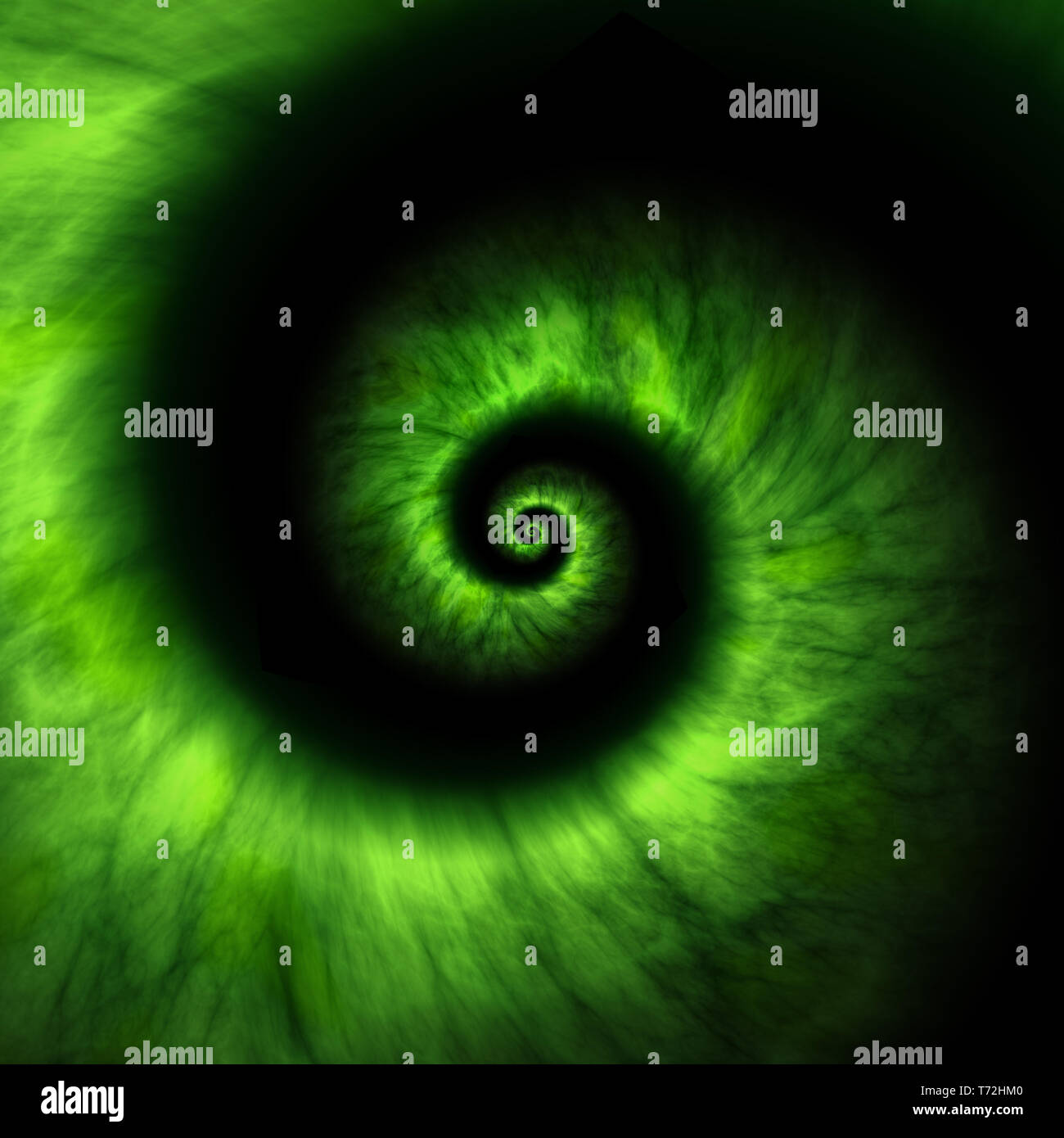 a green light energy spiral on black background Stock Photo - Alamy