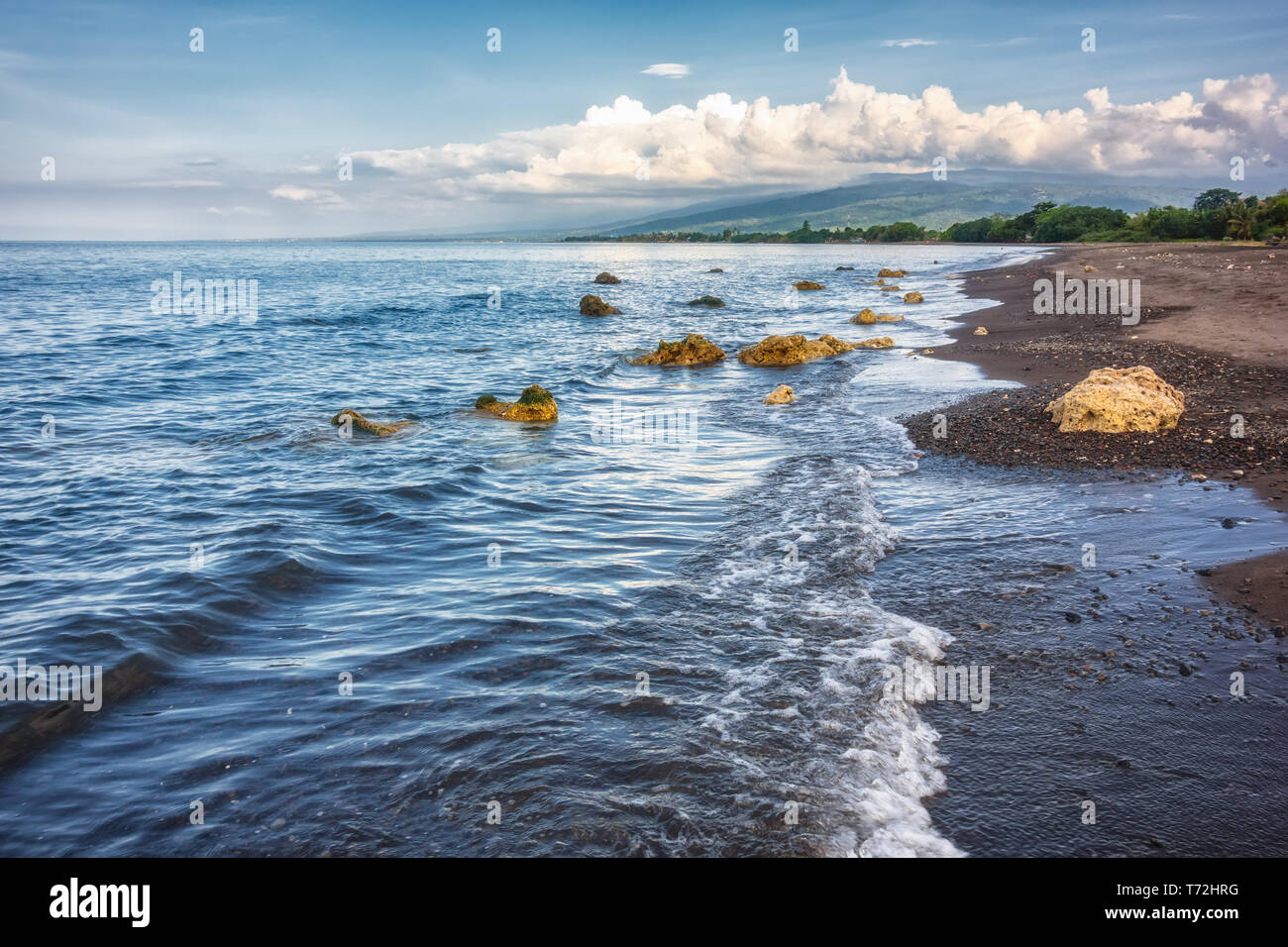 a dark sand beach in northern Bali Indonesia Stock Photo - Alamy