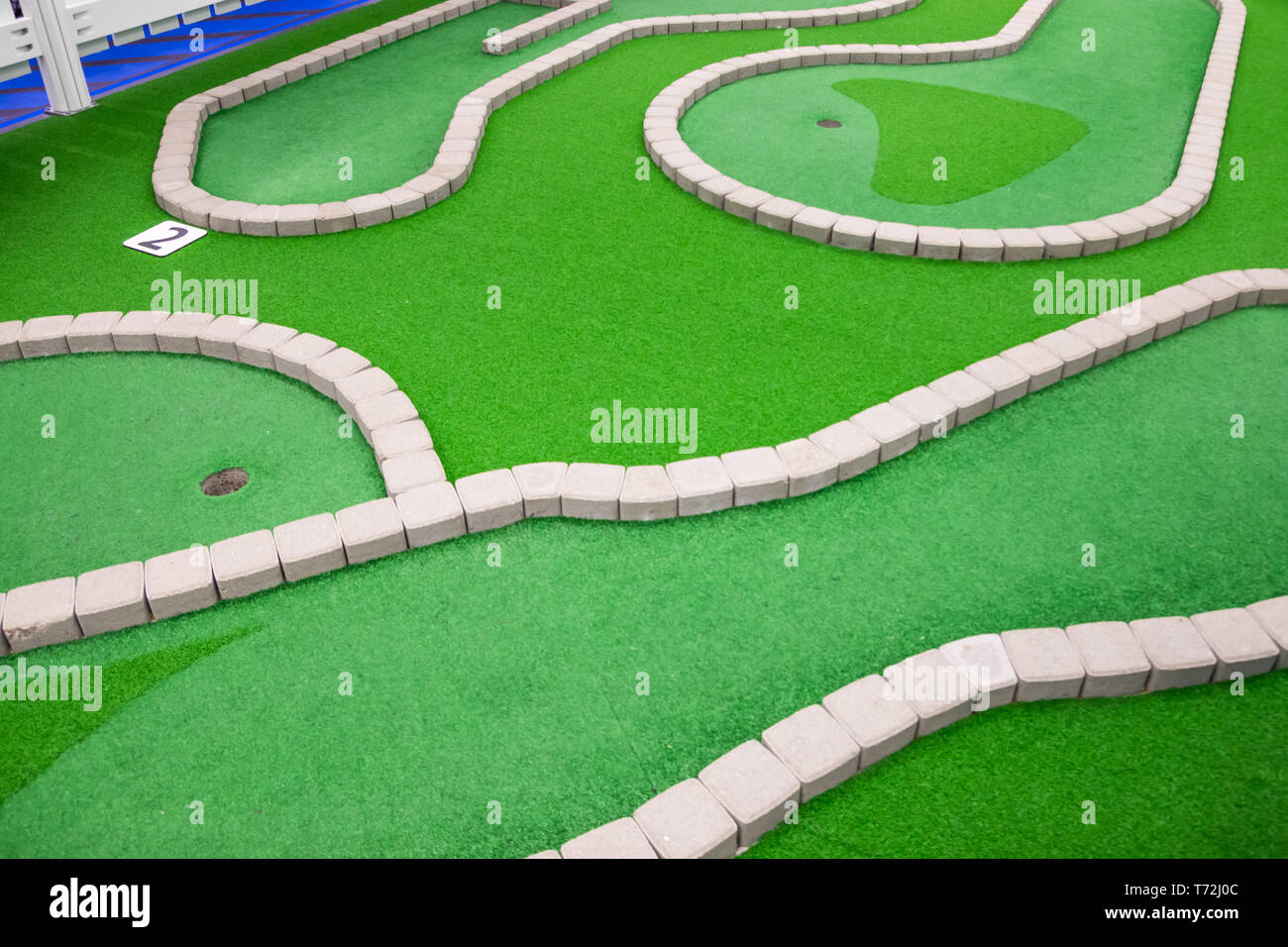 Mini golf court in children activity park Stock Photo - Alamy