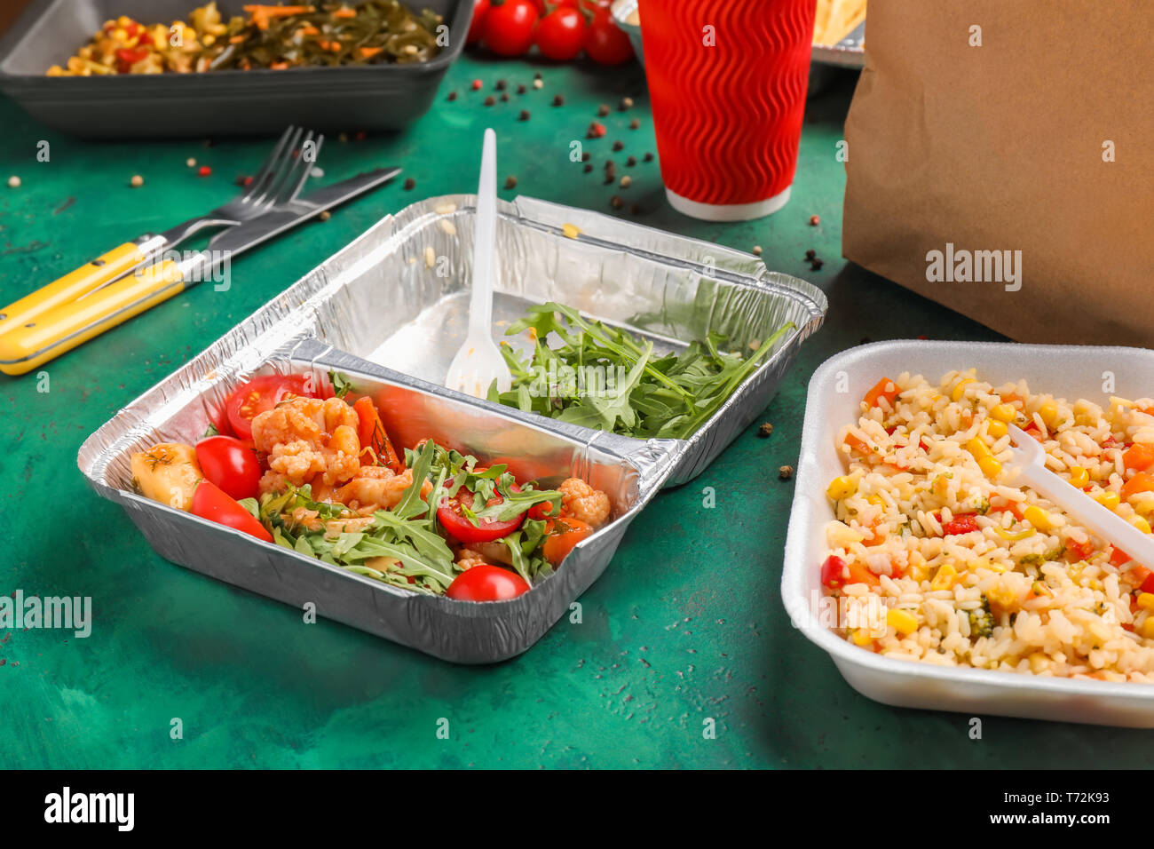 Food delivery containers on textured table Stock Photo - Alamy