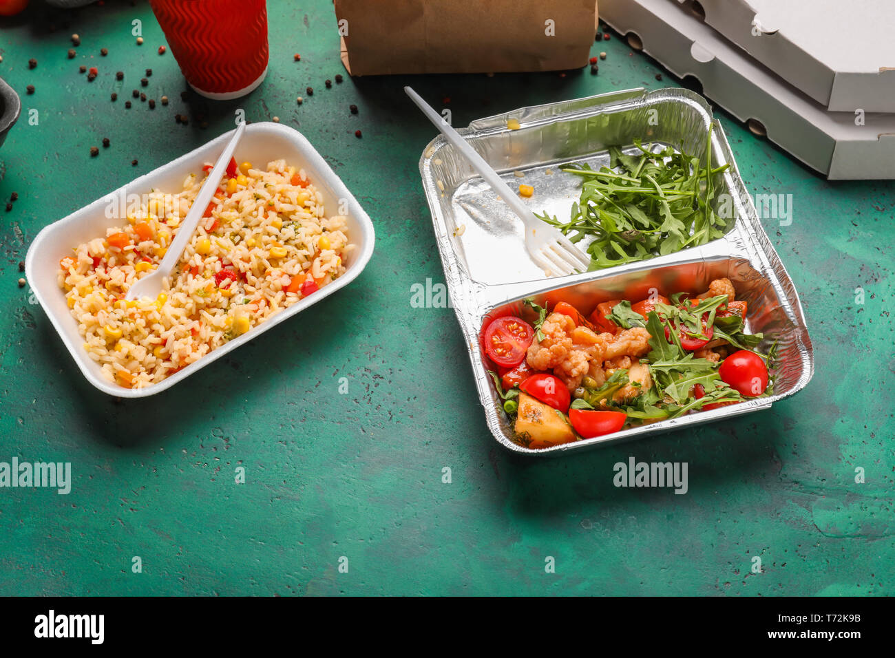 Food delivery containers on textured table Stock Photo - Alamy