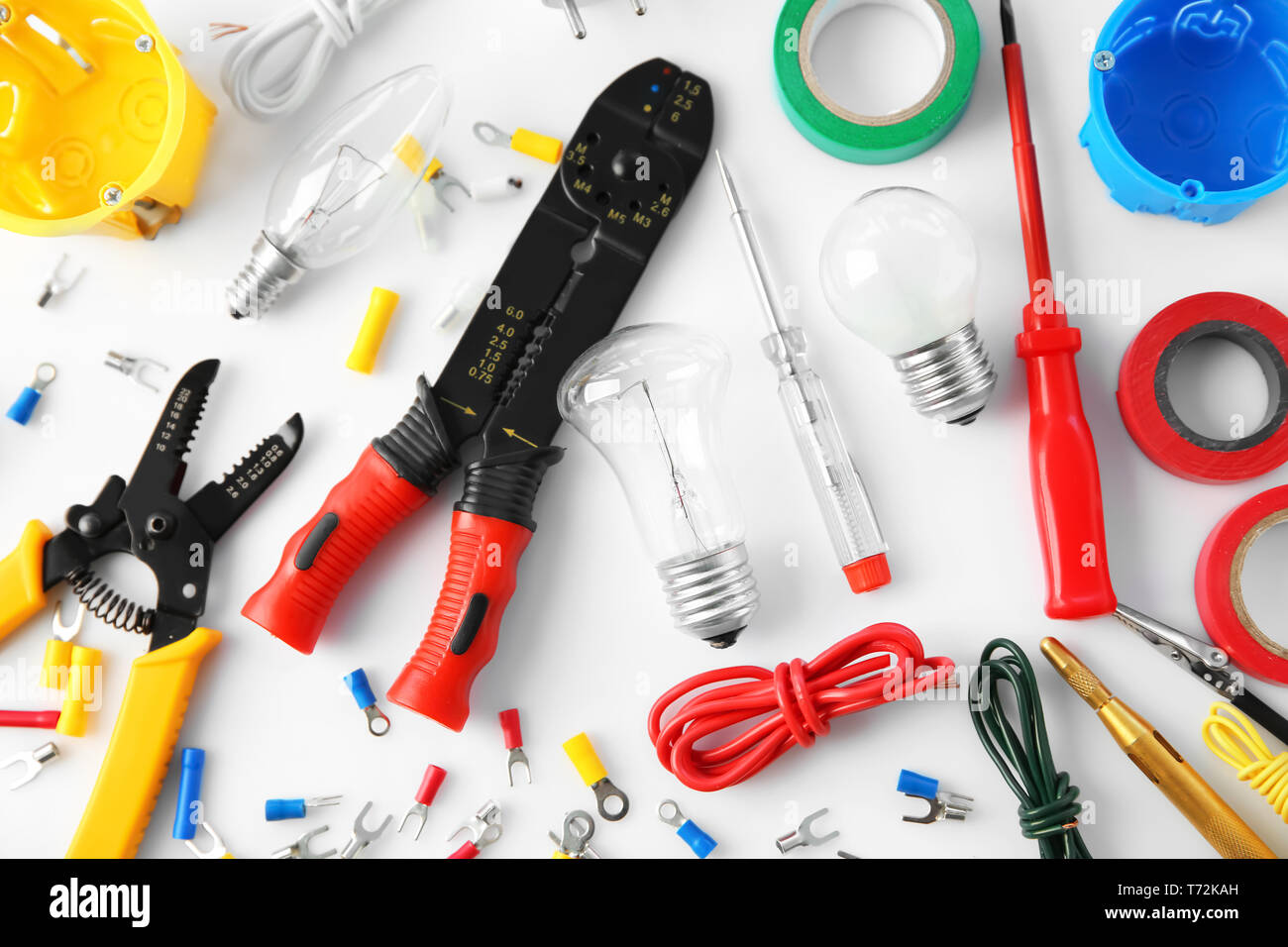 Electrician's supplies on white background Stock Photo - Alamy