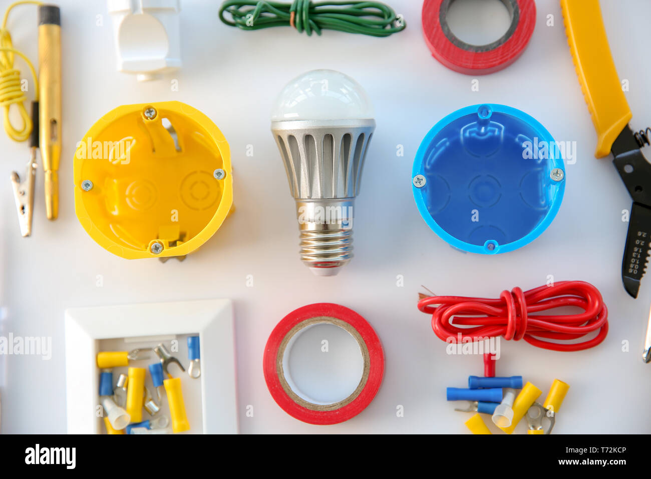 Electrician's supplies on white background Stock Photo - Alamy