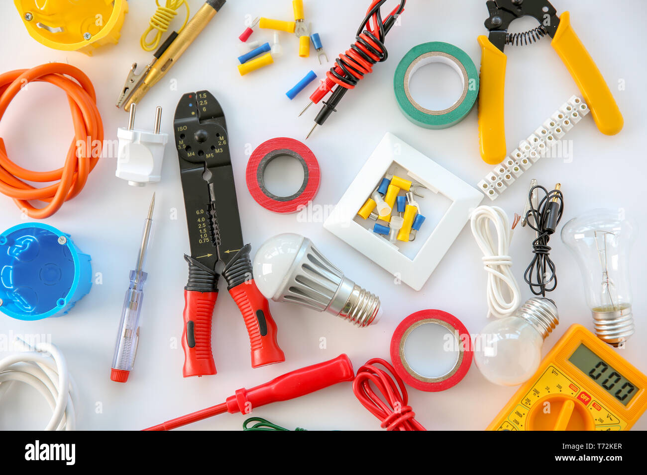Electrician's supplies on white background Stock Photo - Alamy