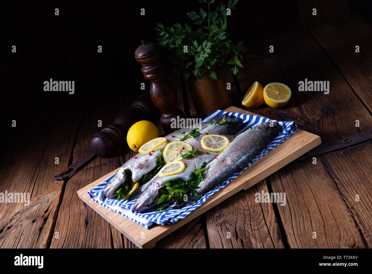 fresh trout with lemon and different herbs Stock Photo - Alamy