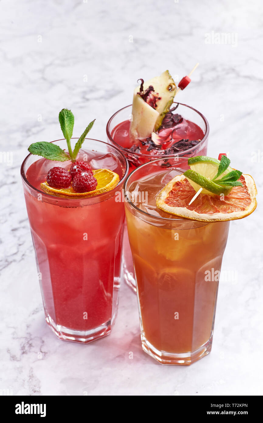 Summer fresh cocktails concept. orange and red alcohol drinks close up ...