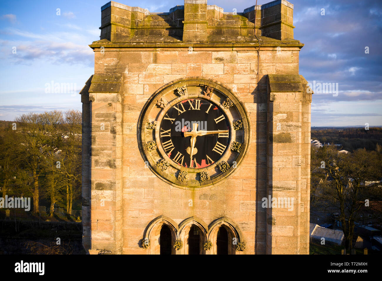 Aerial drone view of clock face on old church tower Stock Photo - Alamy