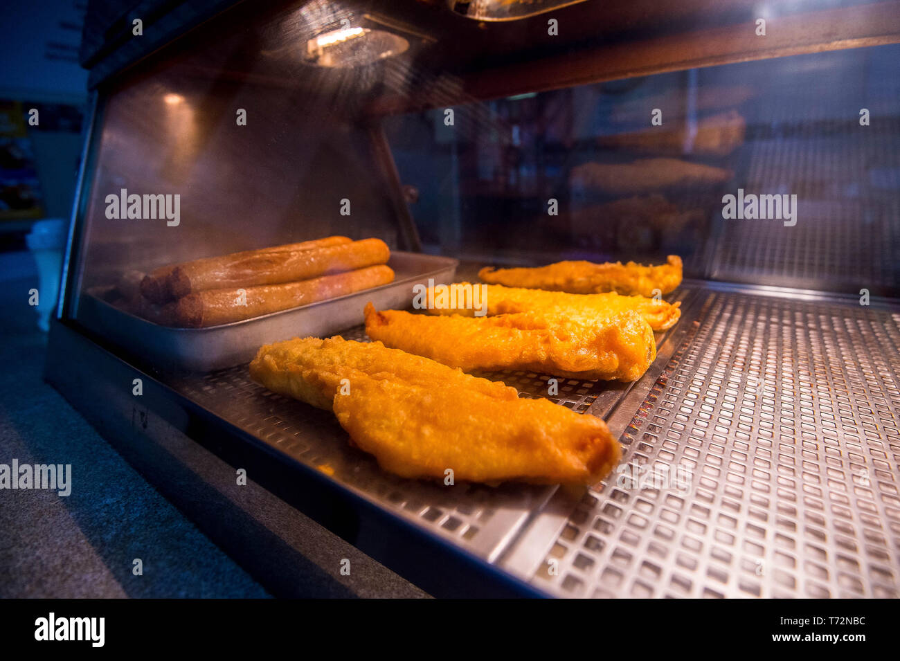 Traditional Battered Cod in a British traditional chip shop or chippy ...