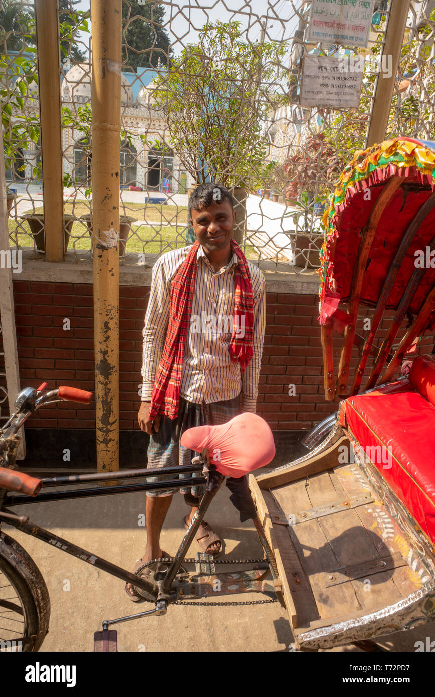 Decorated rickshaw and the driver in old Dhaka, Bangladesh Stock Photo ...