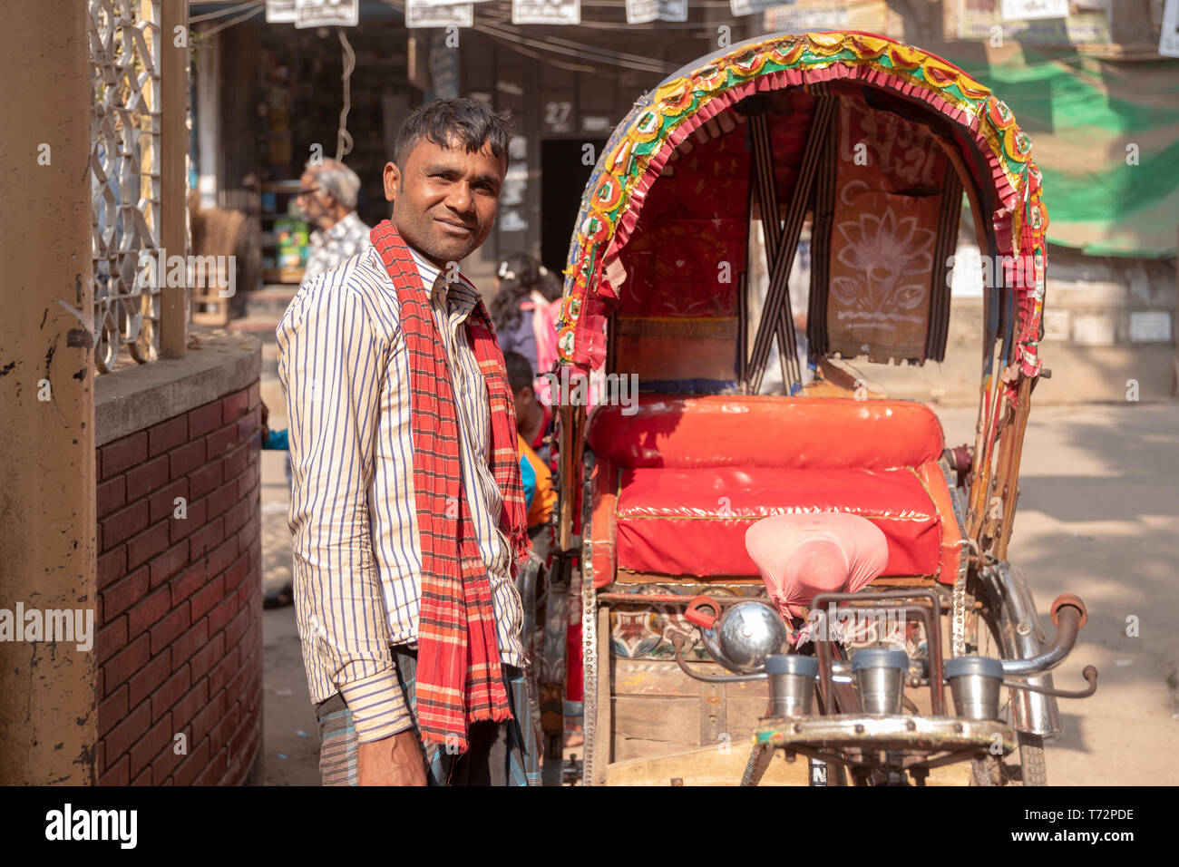 Decorated rickshaw and the driver in old Dhaka, Bangladesh Stock Photo ...