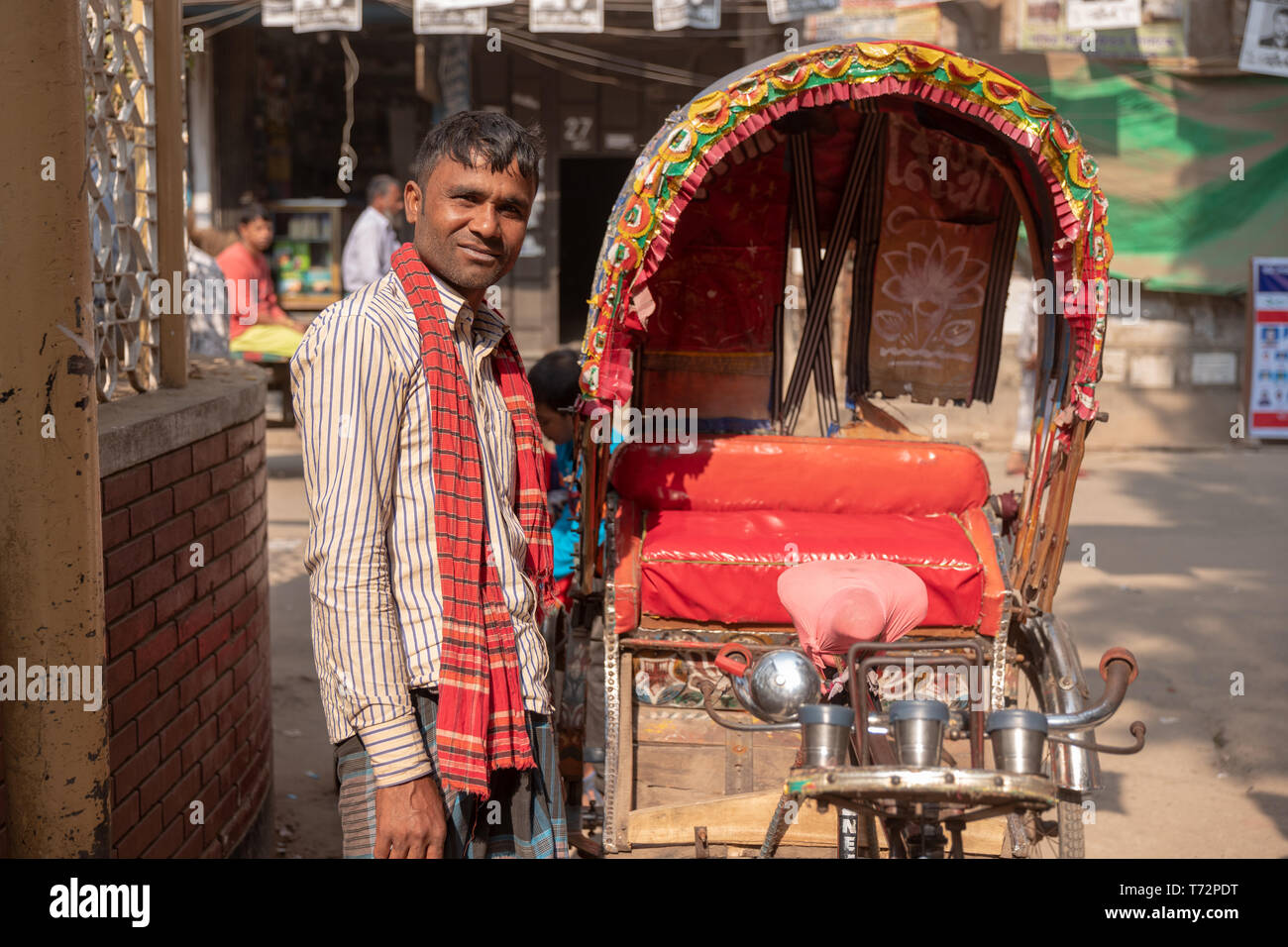 Decorated rickshaw and the driver in old Dhaka, Bangladesh Stock Photo ...