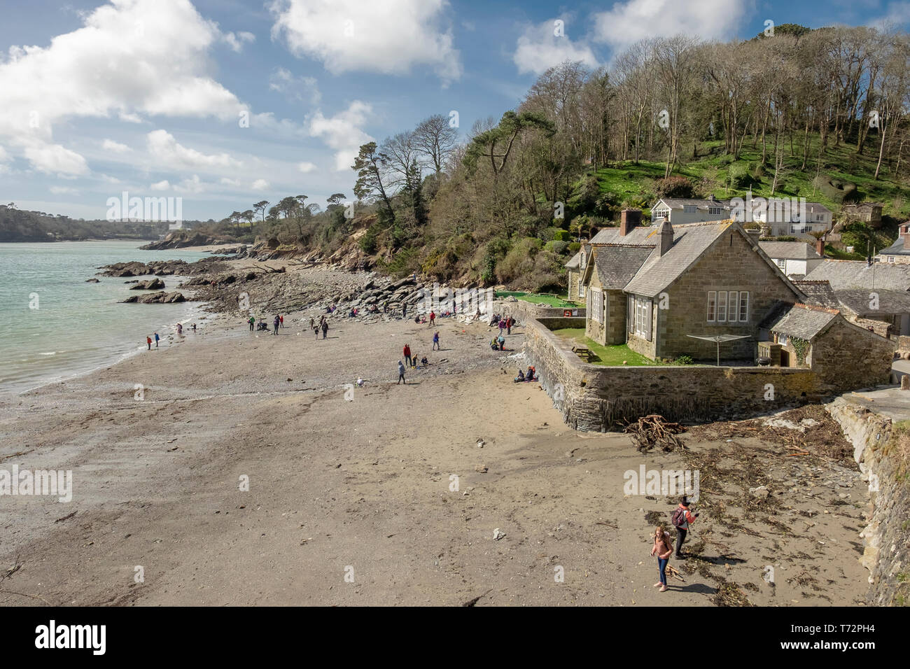 People on the beach at the village of Durgan, on the Helford river ...
