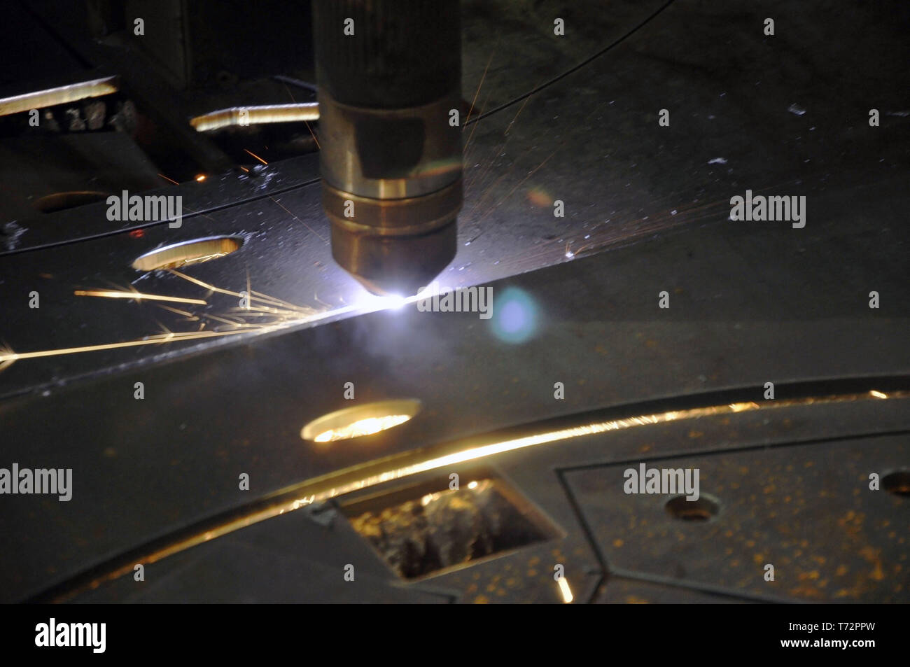 laser cutting torch machine in an industrial plant cuts sheet metal ...