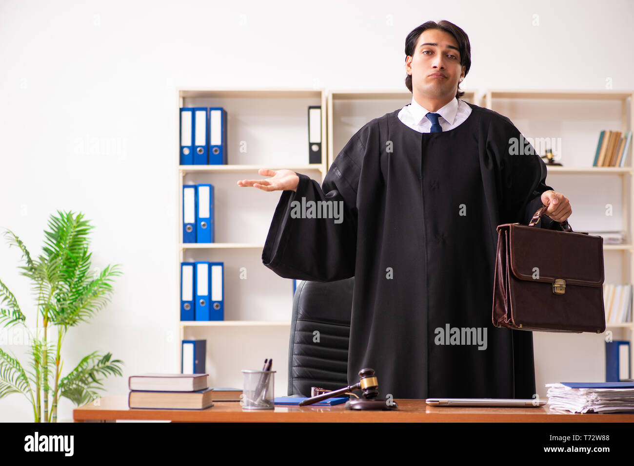 Young handsome judge working in court Stock Photo - Alamy