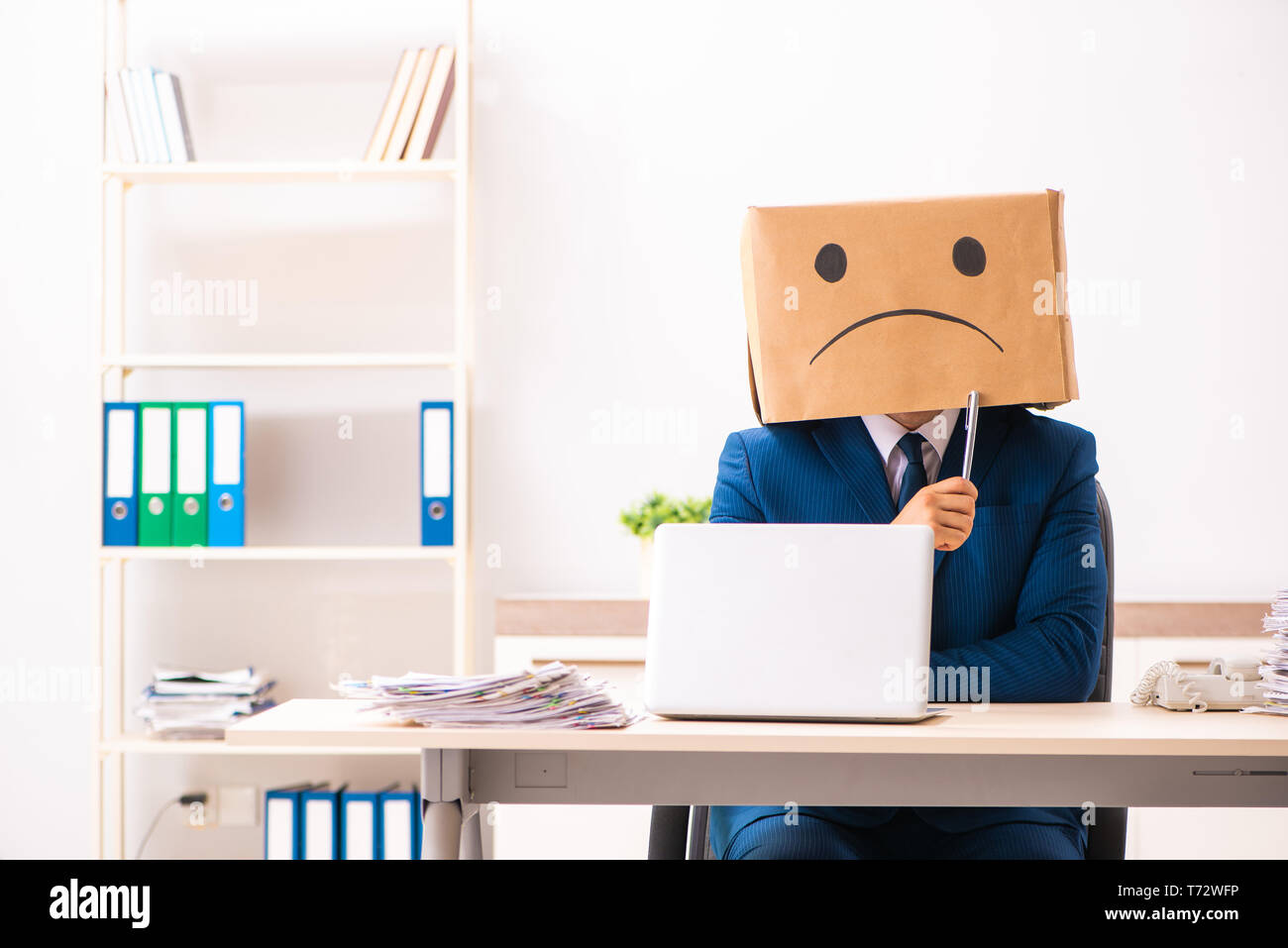 Unhappy man employee with box instead of his head Stock Photo - Alamy