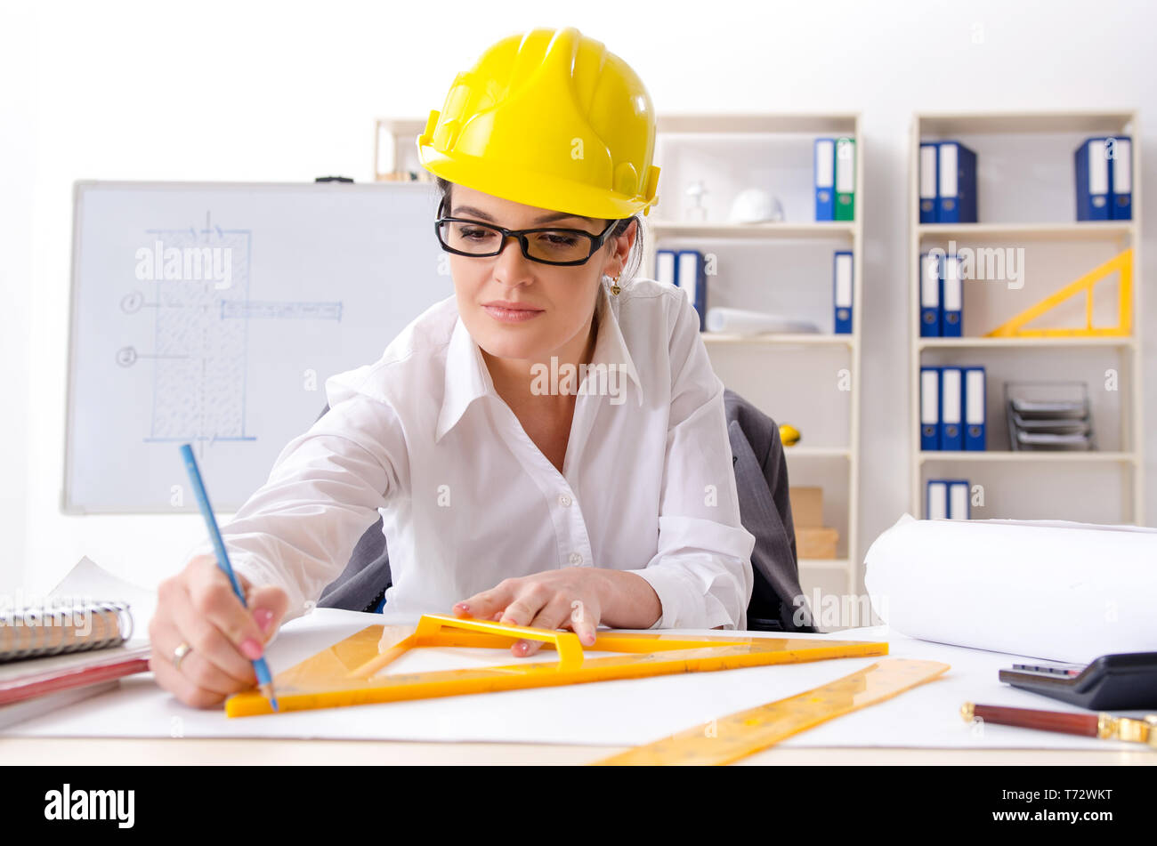 Female architect working in the office Stock Photo - Alamy