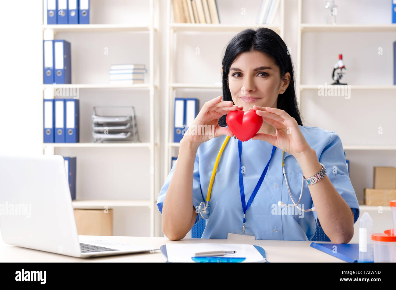 Female doctor cardiologist working in the clinic Stock Photo - Alamy
