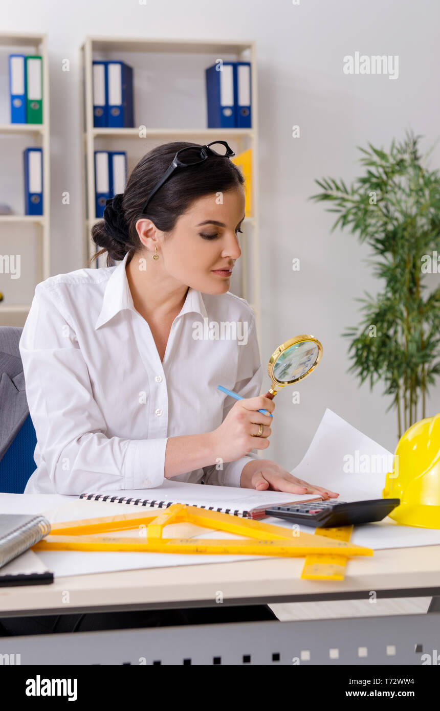 Female architect working in the office Stock Photo - Alamy