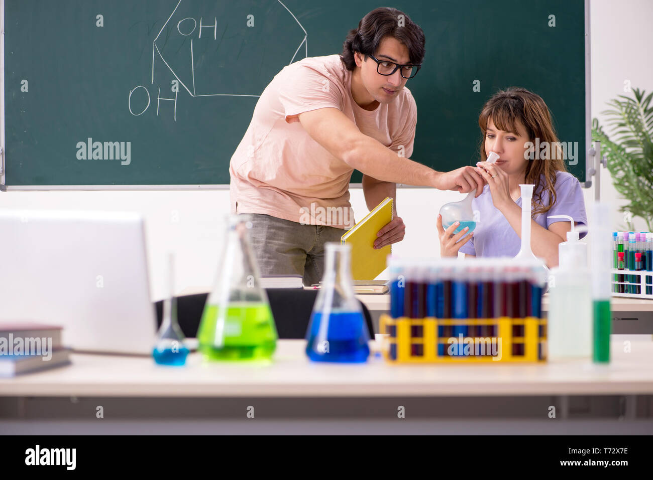 Two chemists students in classroom Stock Photo - Alamy