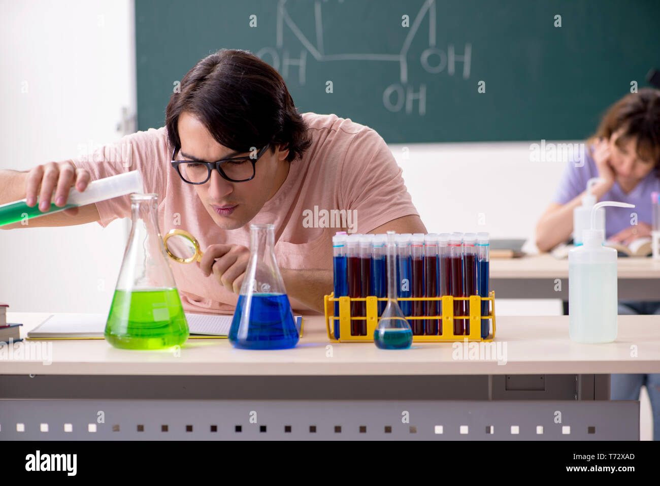 Two chemists students in classroom Stock Photo - Alamy