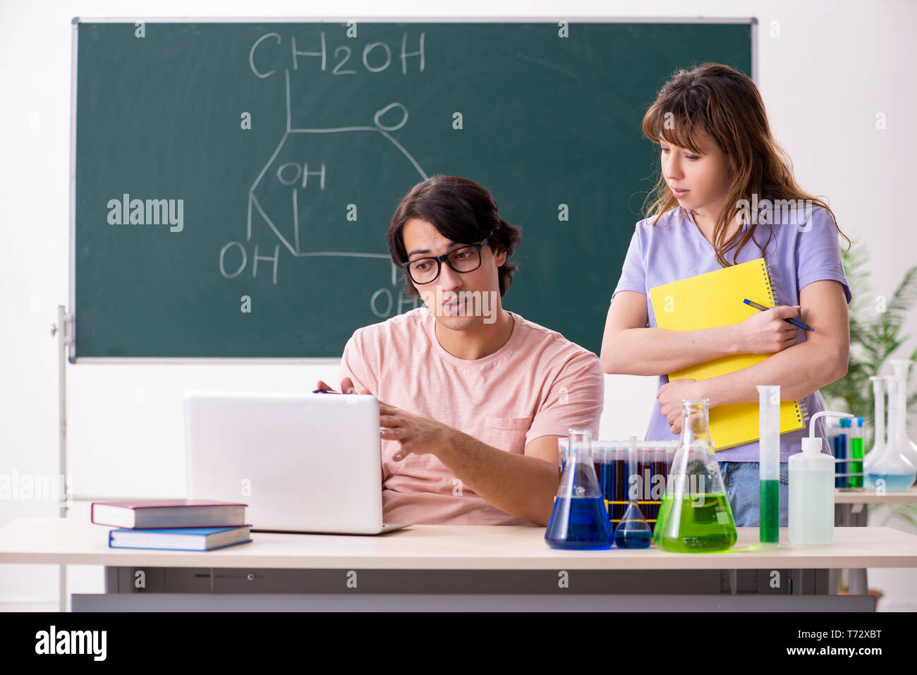 Two chemists students in classroom Stock Photo - Alamy