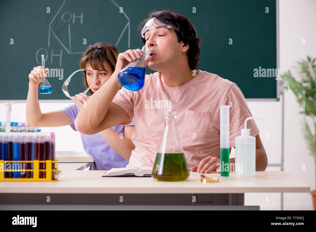 Two chemists students in classroom Stock Photo - Alamy