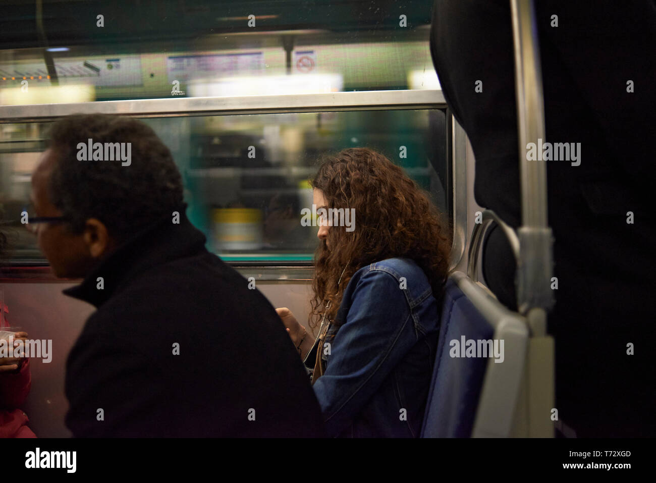 People sitting on the train in the metro in the city of Paris Stock ...