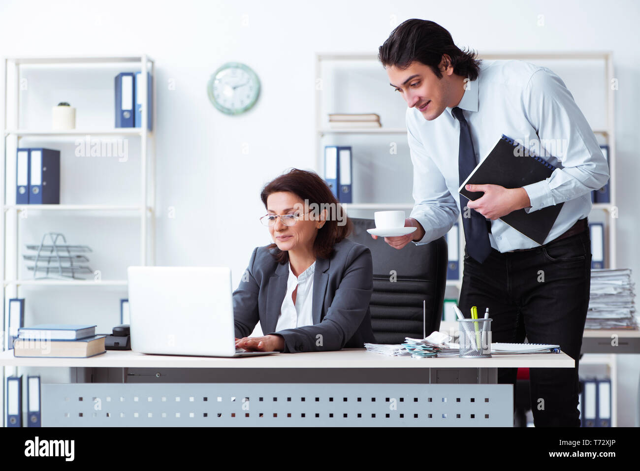 Lady drinking tea at office team hi-res stock photography and images ...