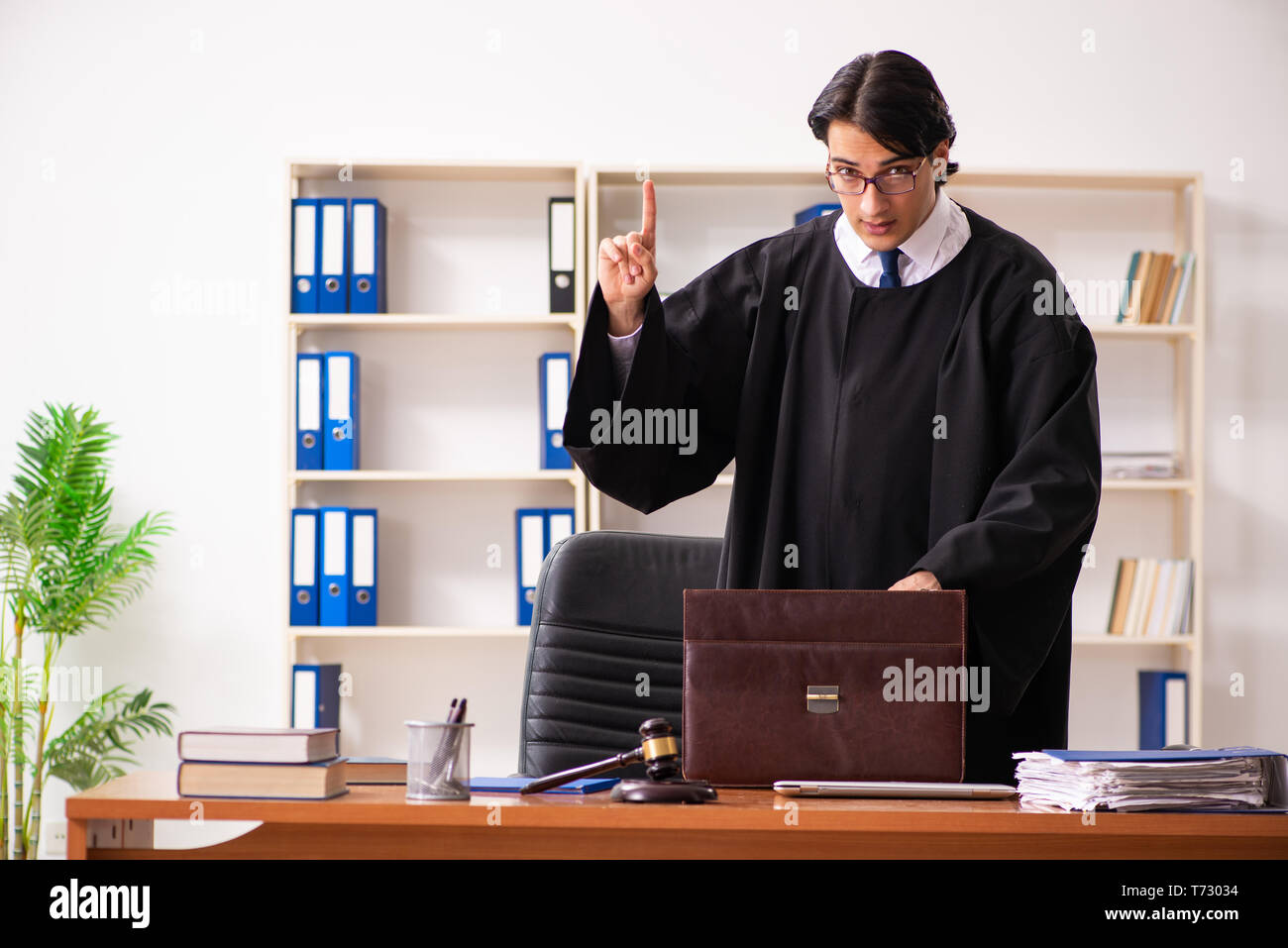 Young handsome judge working in court Stock Photo - Alamy