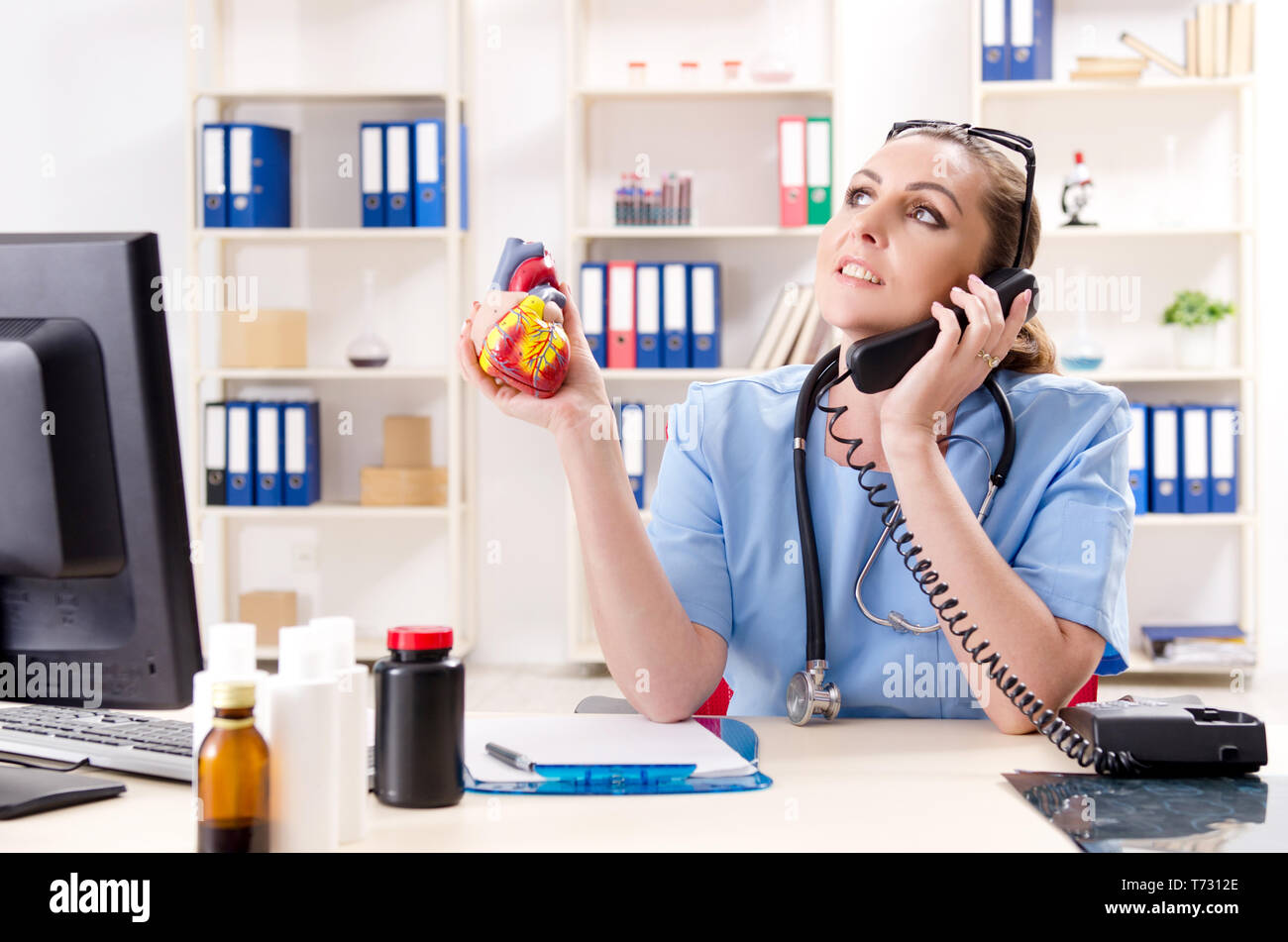 Female doctor cardiologist working in the clinic Stock Photo - Alamy