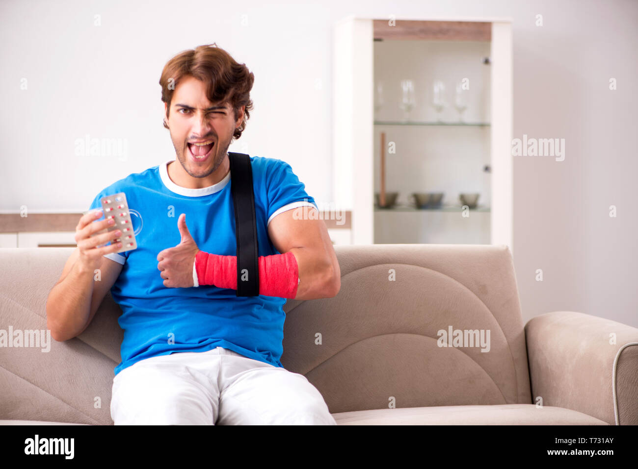 Happy man injured arm hi-res stock photography and images - Alamy