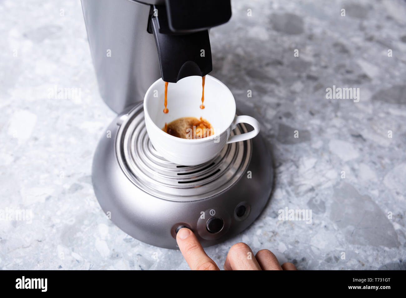 Close-up Of Person's Hand Pressing The Button On A Coffee Maker Taking ...
