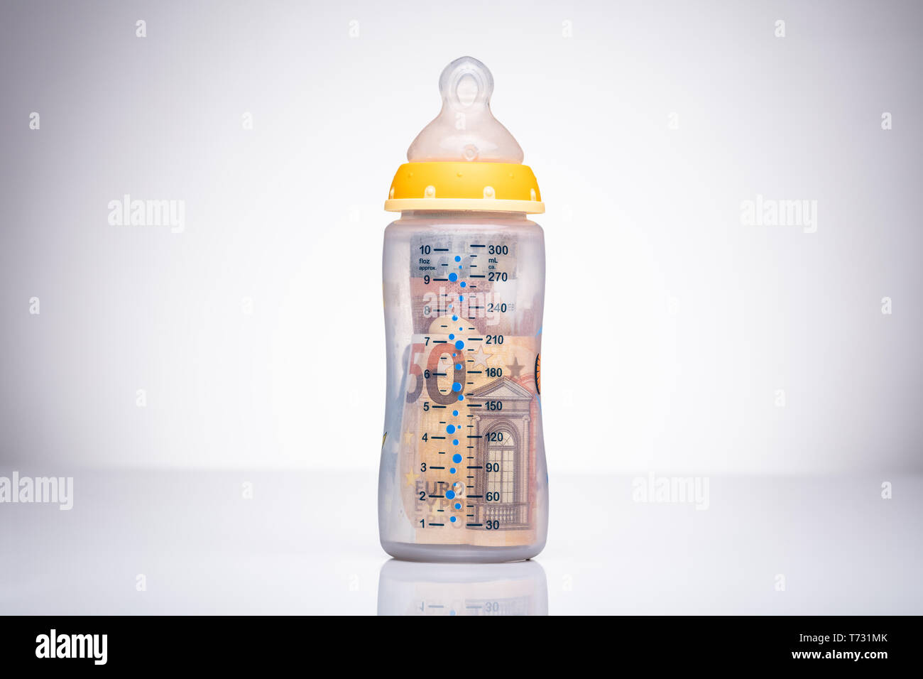 Baby bottle with notes hi-res stock photography and images - Alamy