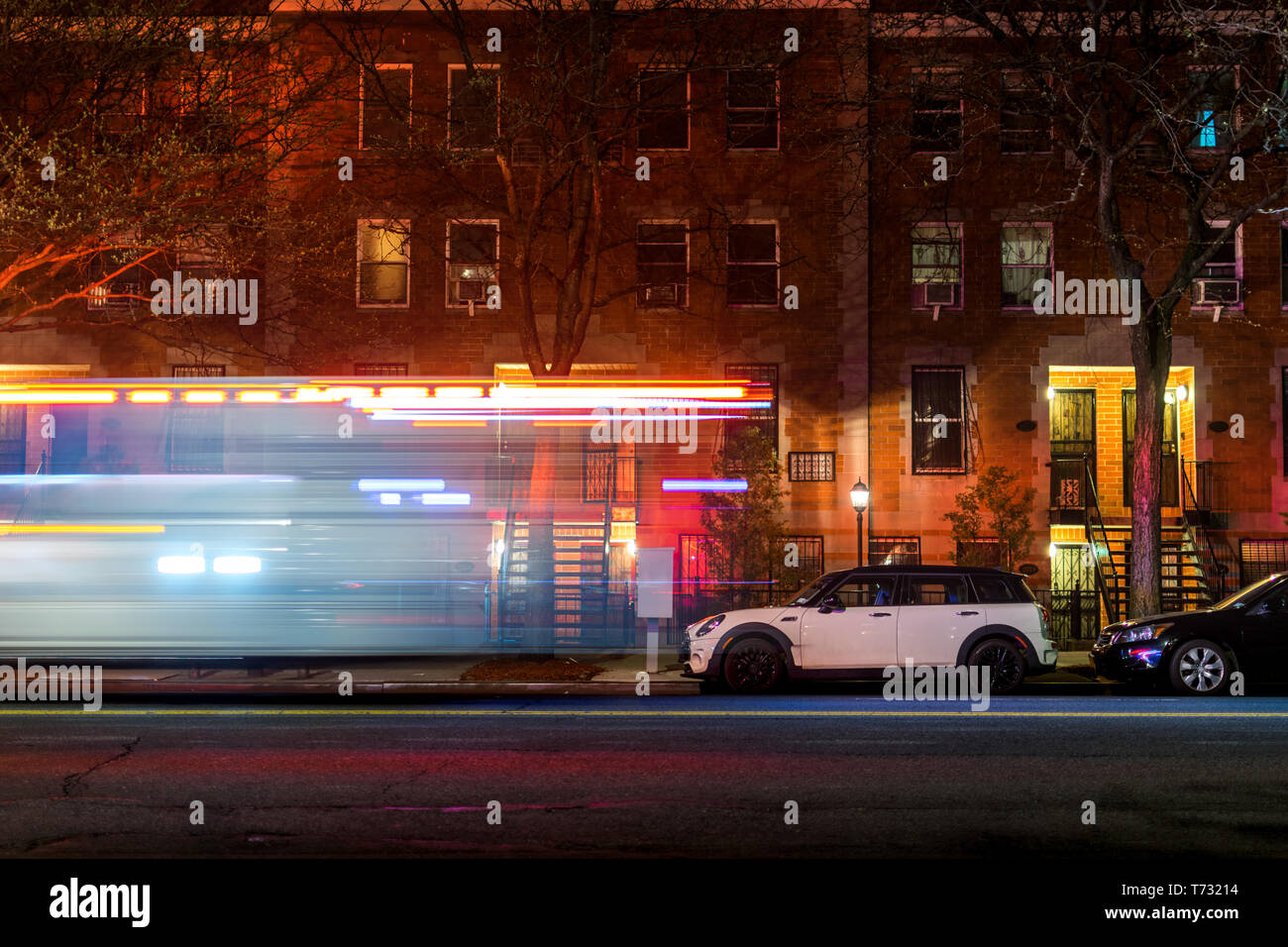 Light streaks from a New York City firetruck or ambulance speeding down ...