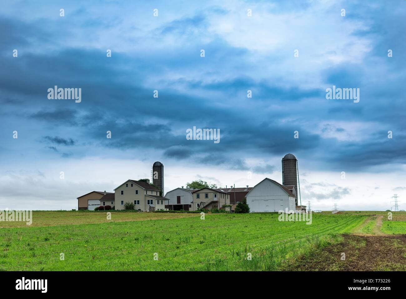 Simple Amish farm house with silos in rural Pennsylvania, Lancaster ...