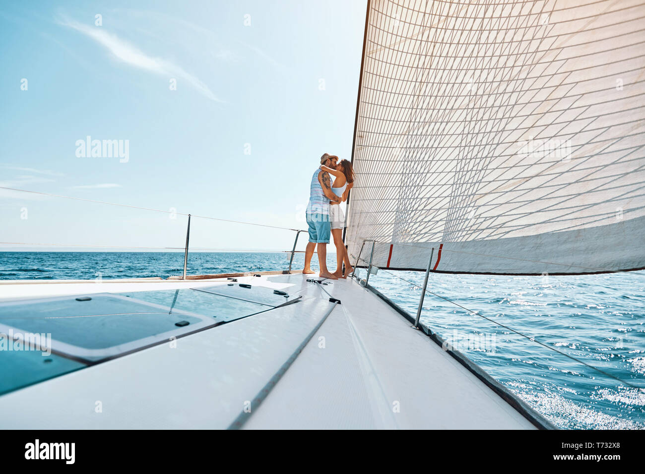 Young happy man and woman in love sailing sailboat yacht Stock Photo ...