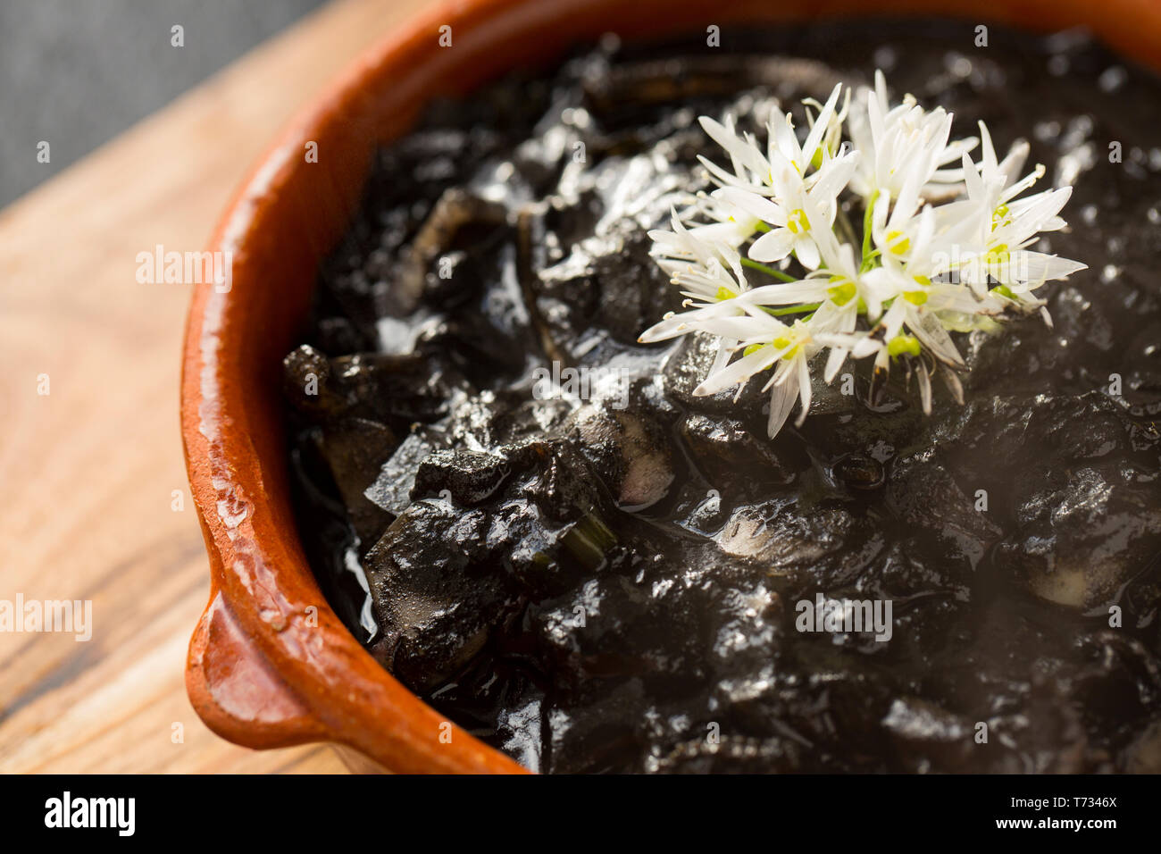 A bowl of freshly prepared cuttlefish, Sepia officinalis, from a ...