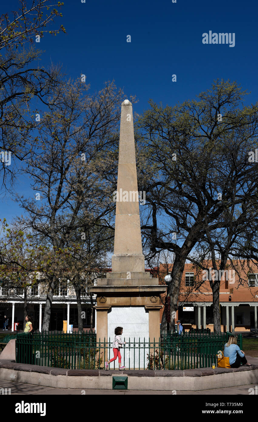 Children play near the historic 19th century obelisk in the plaza in ...
