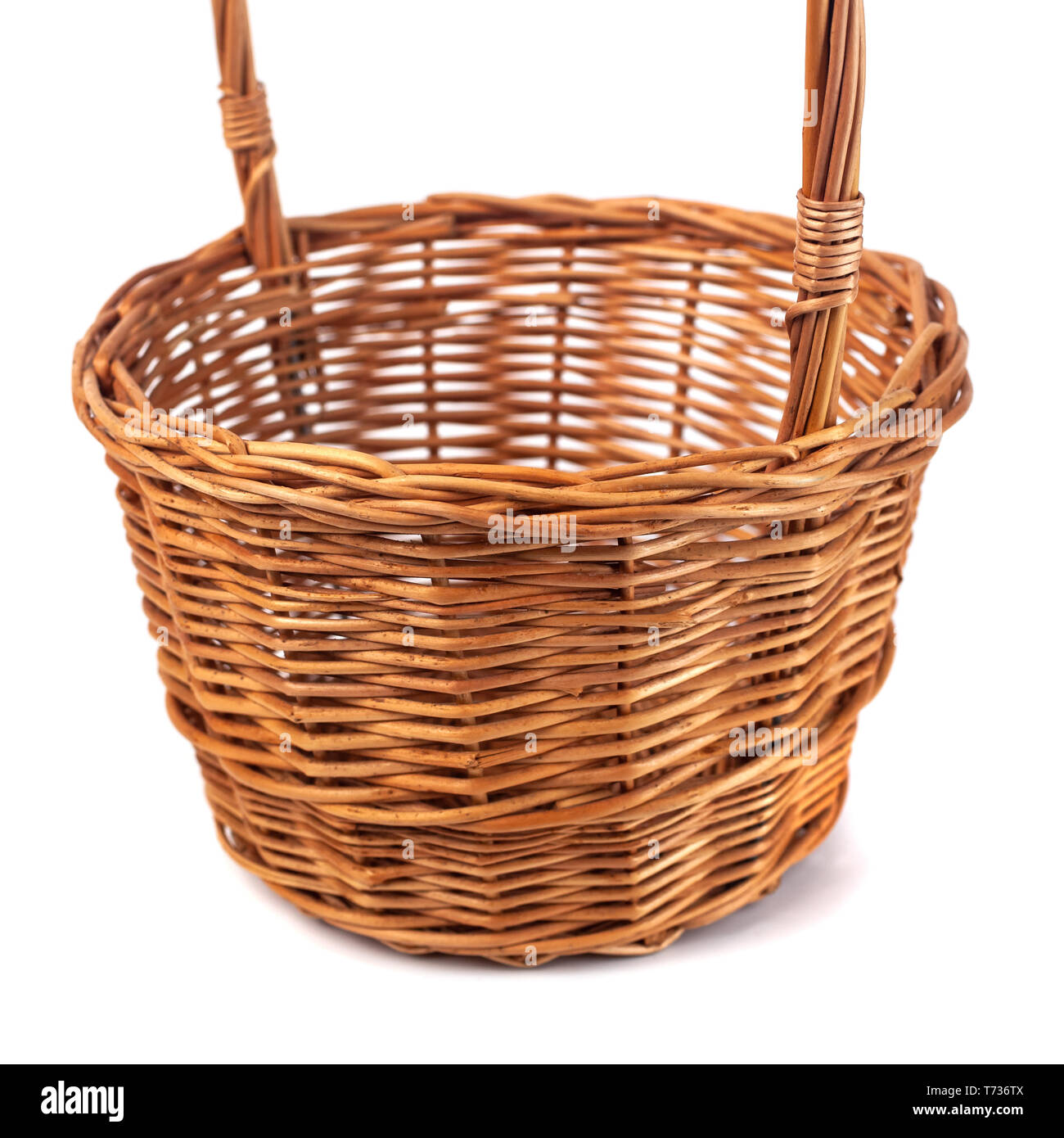 Empty wicker basket for fruits and vegetables isolated on white ...