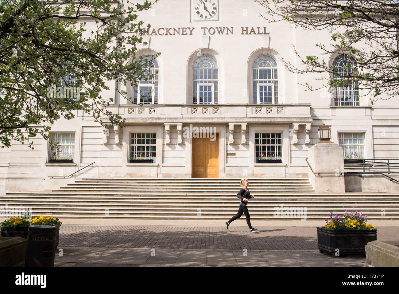 Hackney, London, England, UK - Facade of Hackney town hall with woman ...