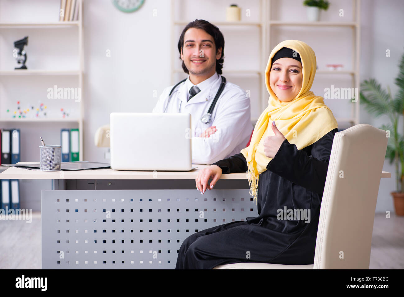Female arab patient visiting male doctor Stock Photo - Alamy