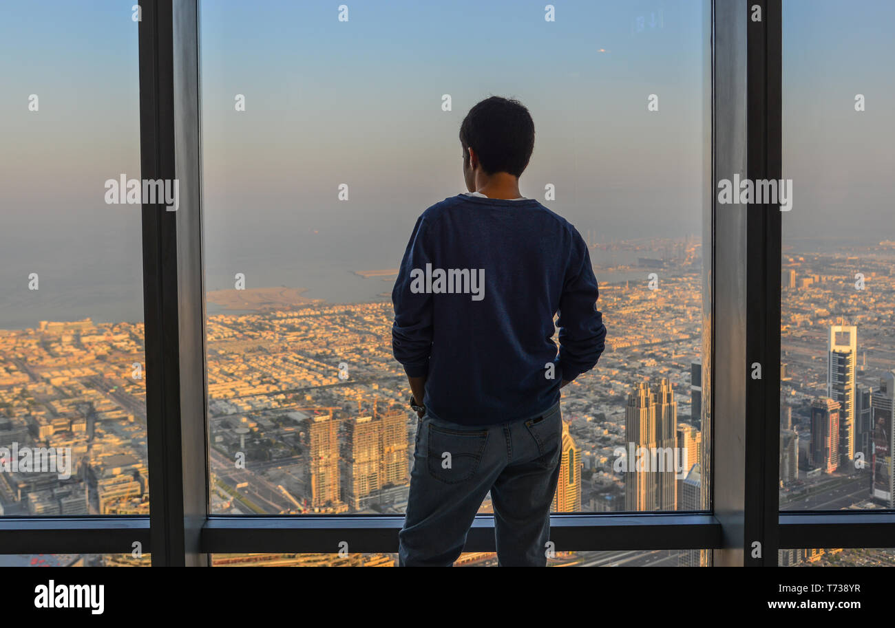 Dubai, UAE - Dec 7, 2018. A man enjoying at the observation deck of the ...