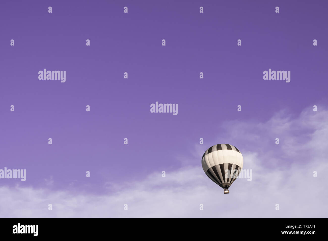 Hot air balloon floating in the air Stock Photo - Alamy