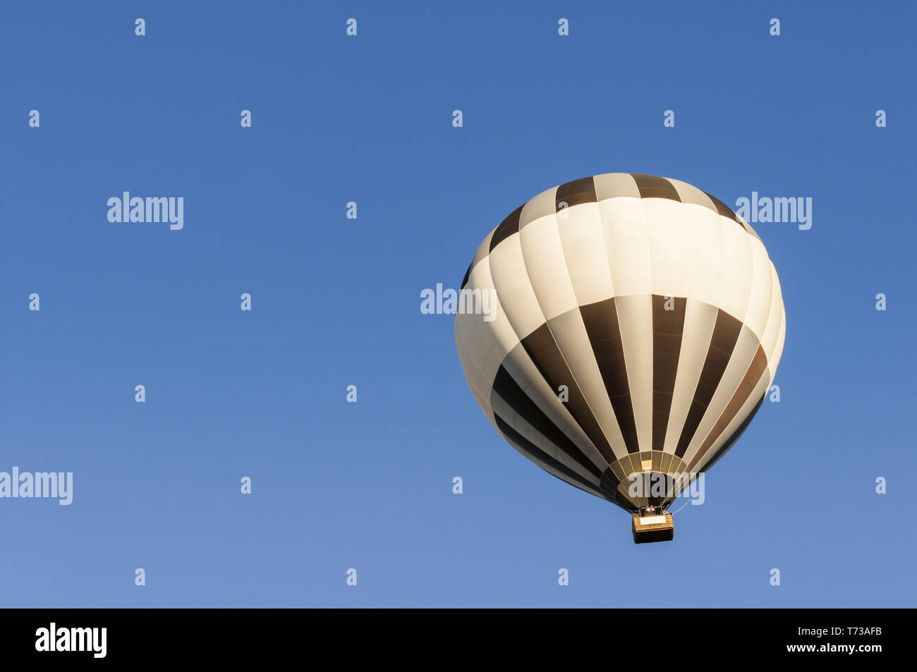 Hot air balloon floating in the air Stock Photo - Alamy