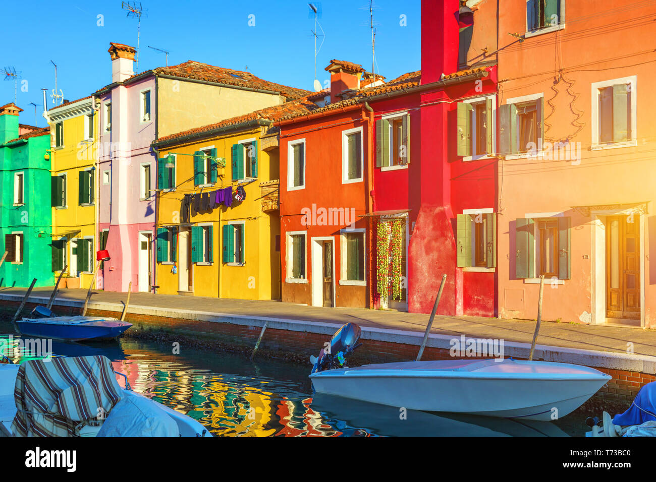 Street with colorful buildings in Burano island, Venice, Italy ...
