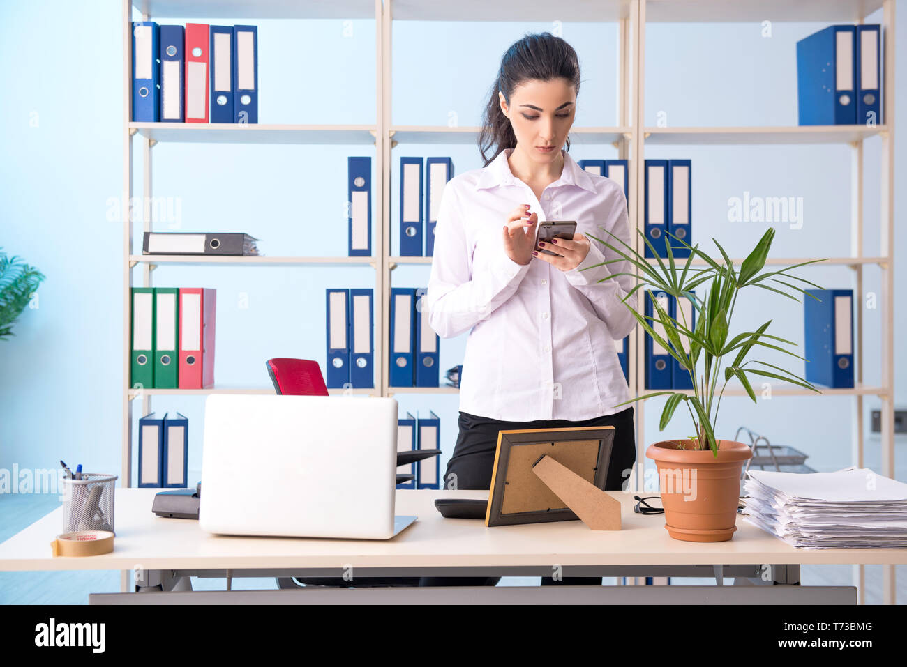 Female employee working late in the office Stock Photo - Alamy