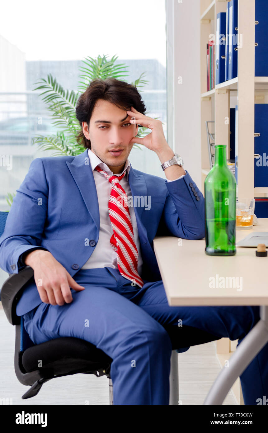 Young drunk employee in the office hi-res stock photography and images ...